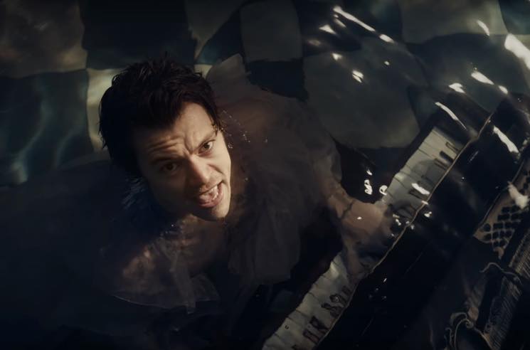 Harry Styles Fights Against Rising Waters in "Falling" Video | Exclaim!